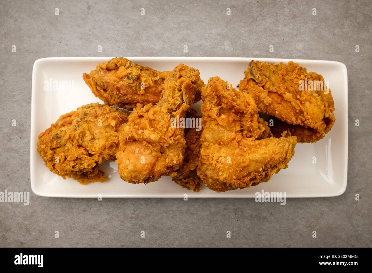 Fried chicken on white background Stock Photo - Alamy