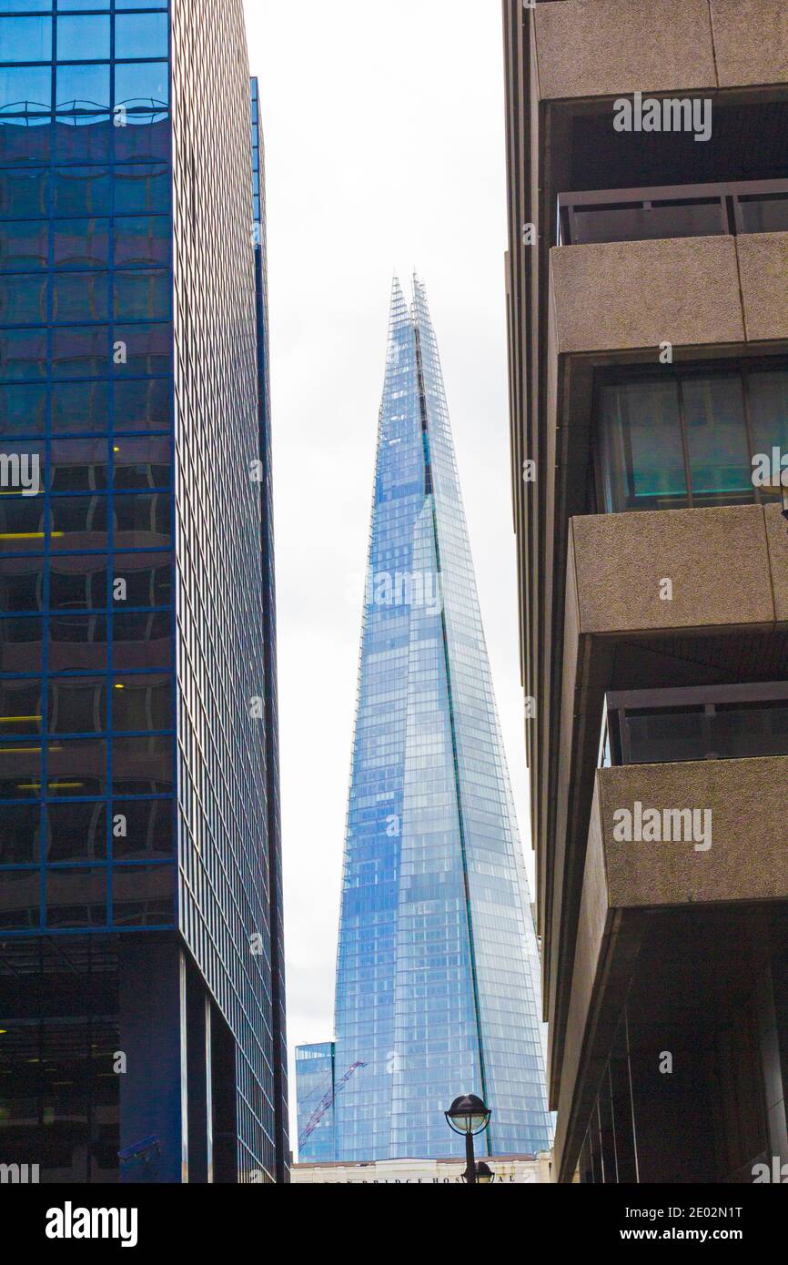 The Shard building seen between the business buildings in The City of ...