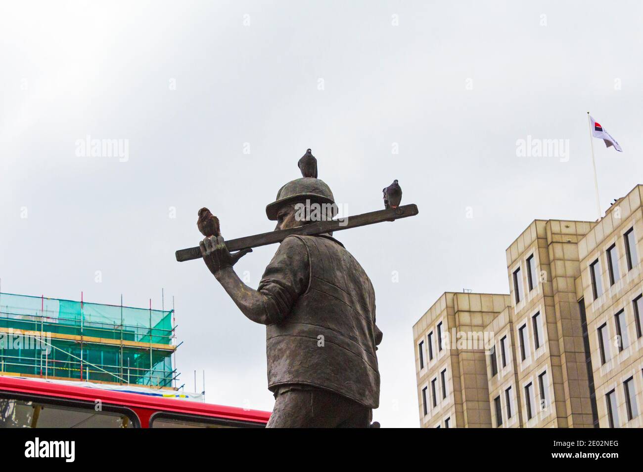 Building Worker bronze statue next to the bus stop London, England ...