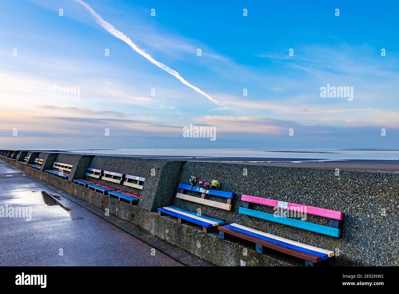 The colourful benches along the New Brighton Promenade Stock Photo - Alamy