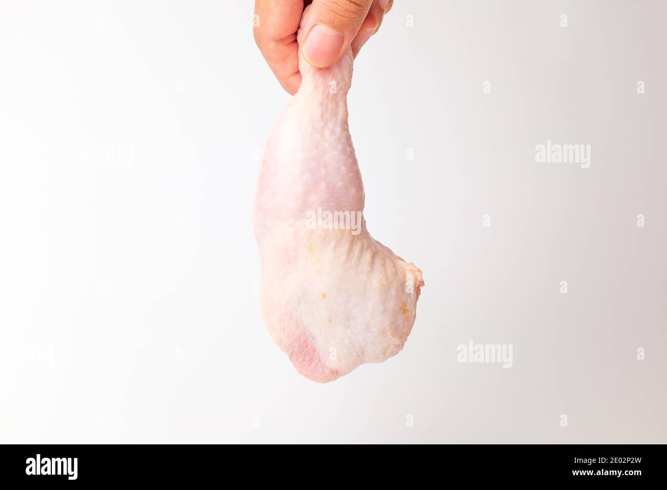 Trimmed chicken legs on a white background Stock Photo - Alamy