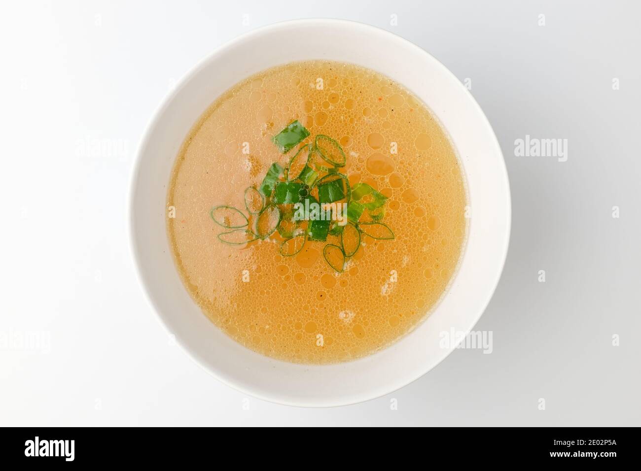 Chicken stock on a white background Stock Photo - Alamy