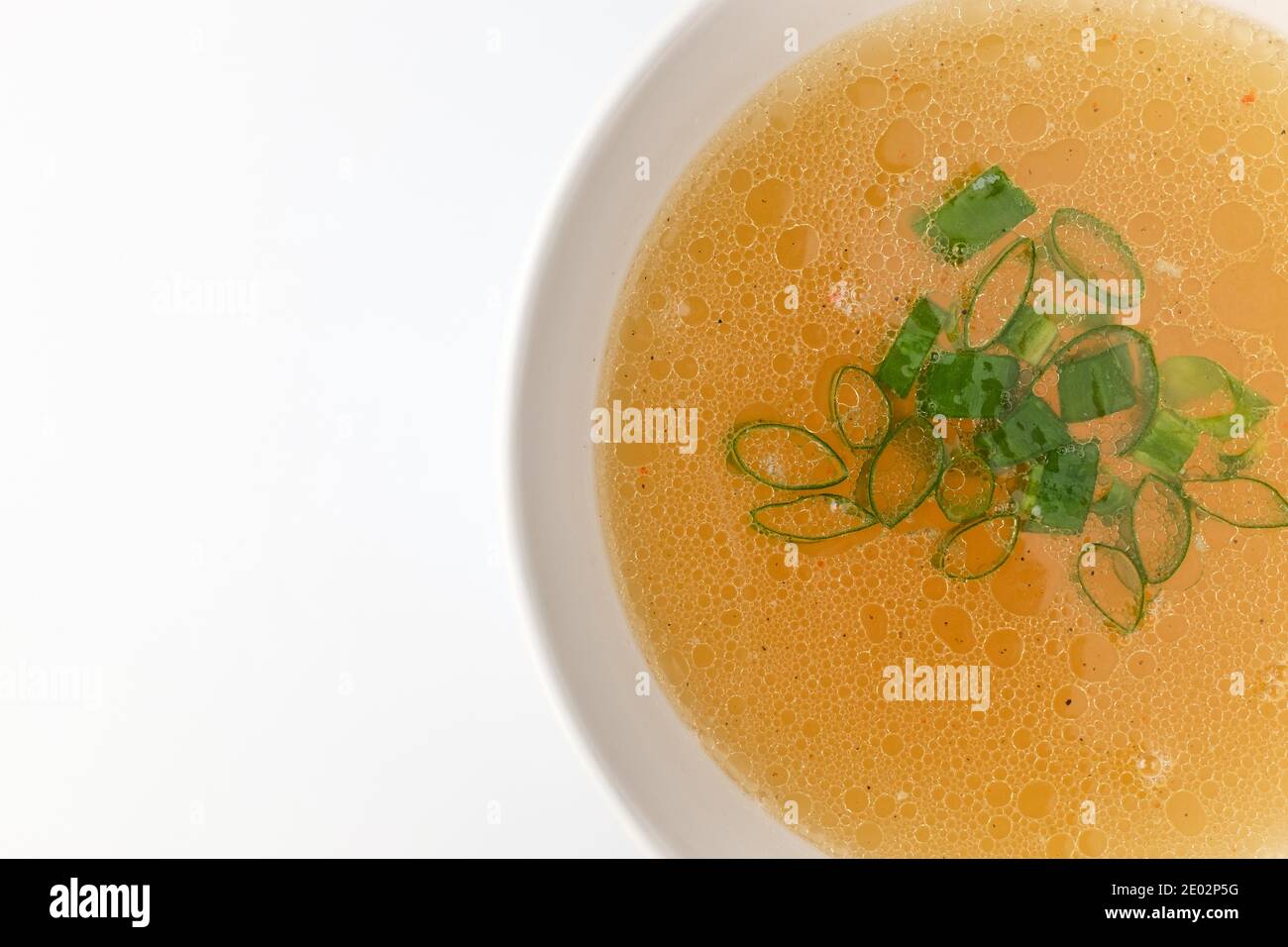 Chicken stock on a white background Stock Photo - Alamy