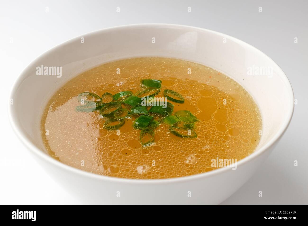 Chicken stock on a white background Stock Photo - Alamy