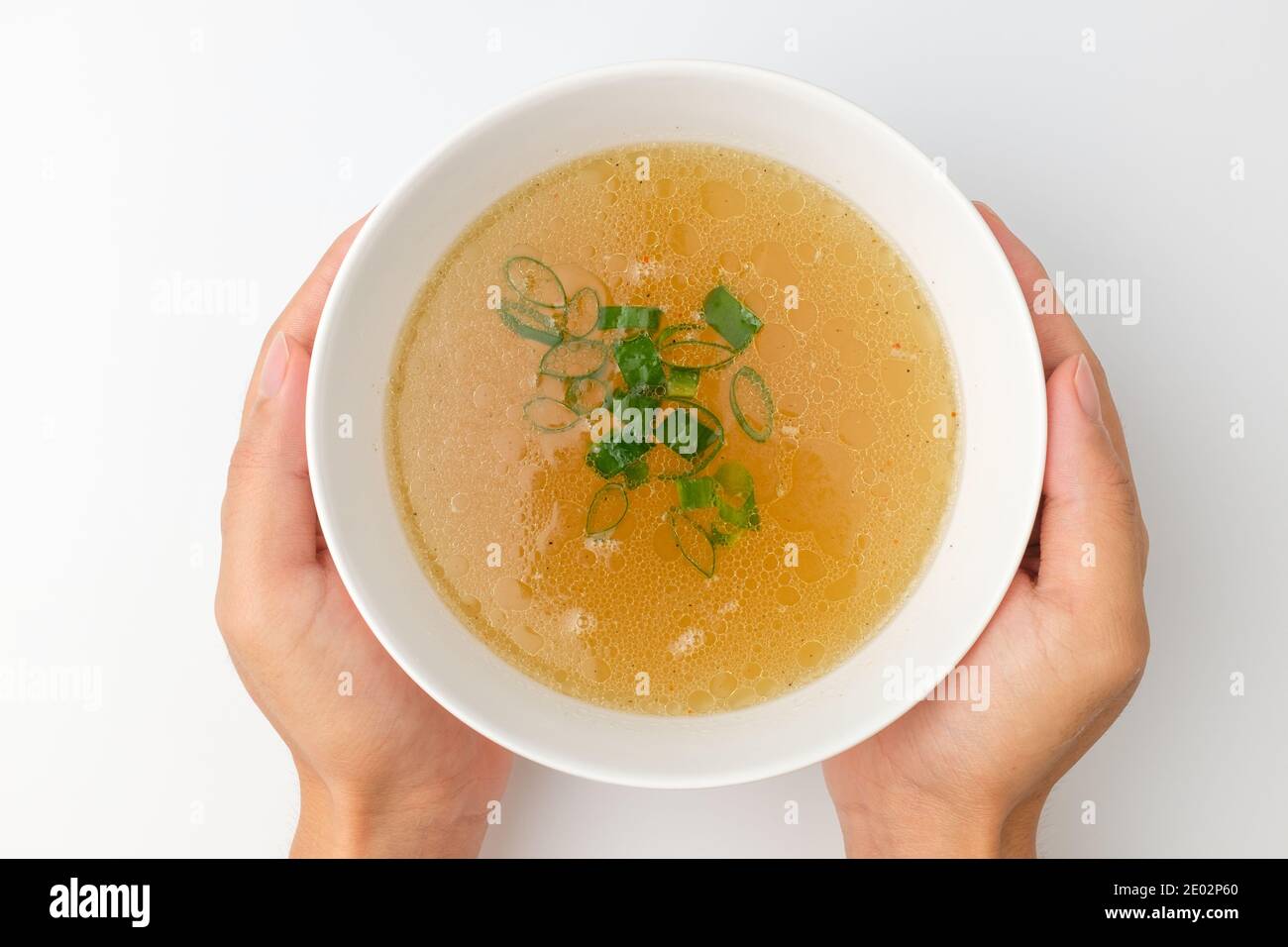 Chicken stock on a white background Stock Photo - Alamy