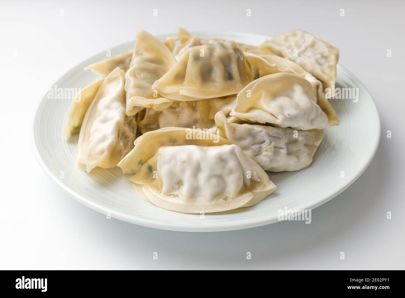 Frozen dumplings on a white background Stock Photo - Alamy
