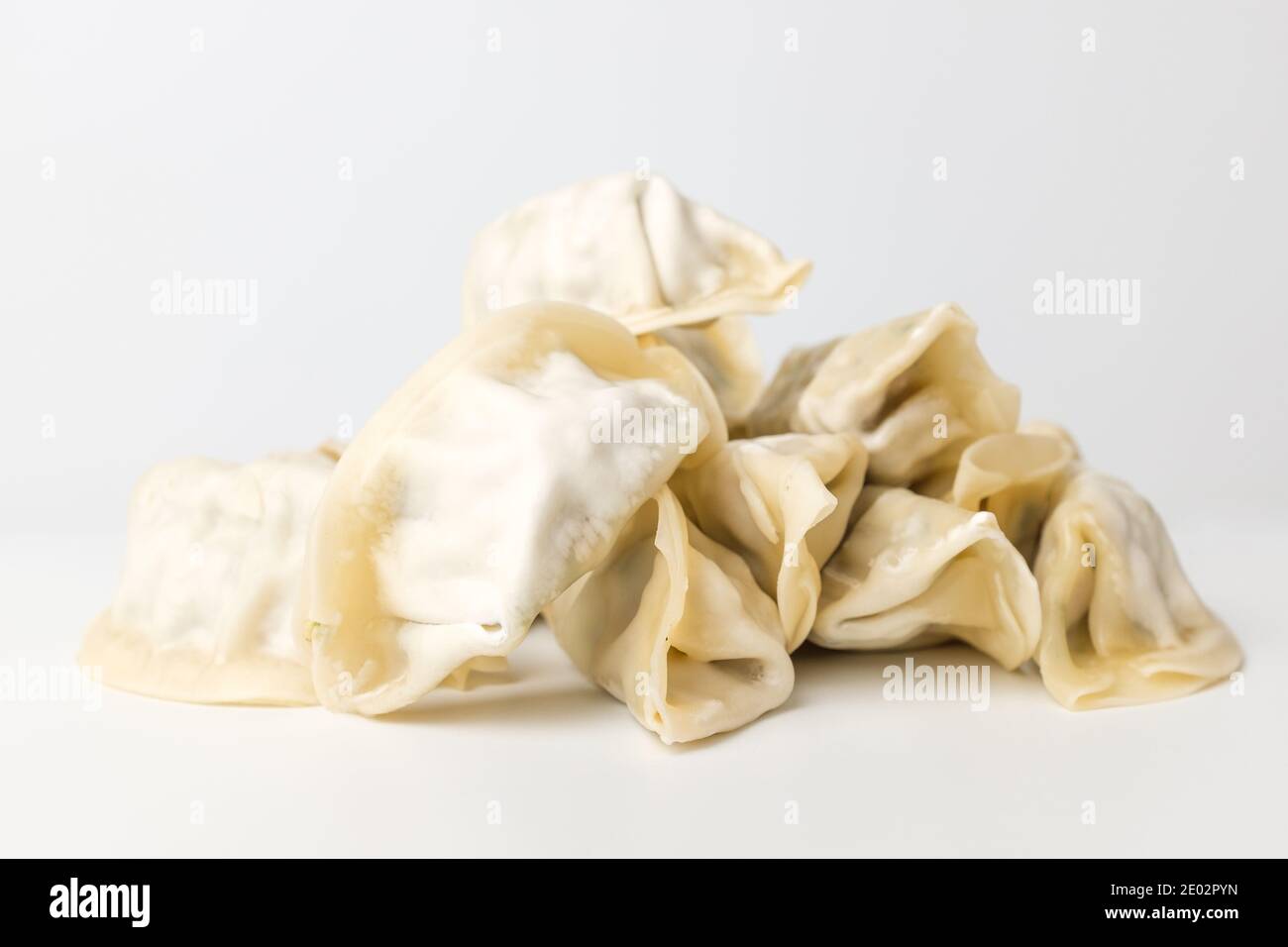 Frozen dumplings on a white background Stock Photo - Alamy