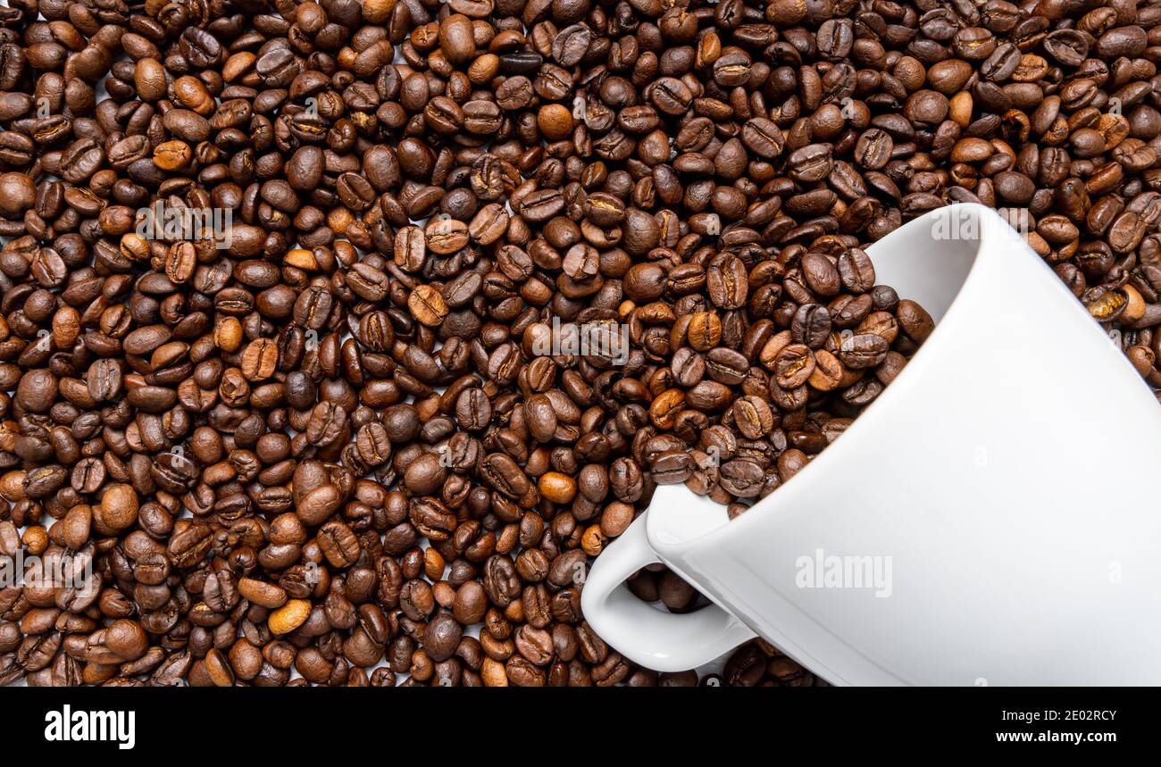 Arabika coffee beans background with coffee cup. Top view of Roasted ...