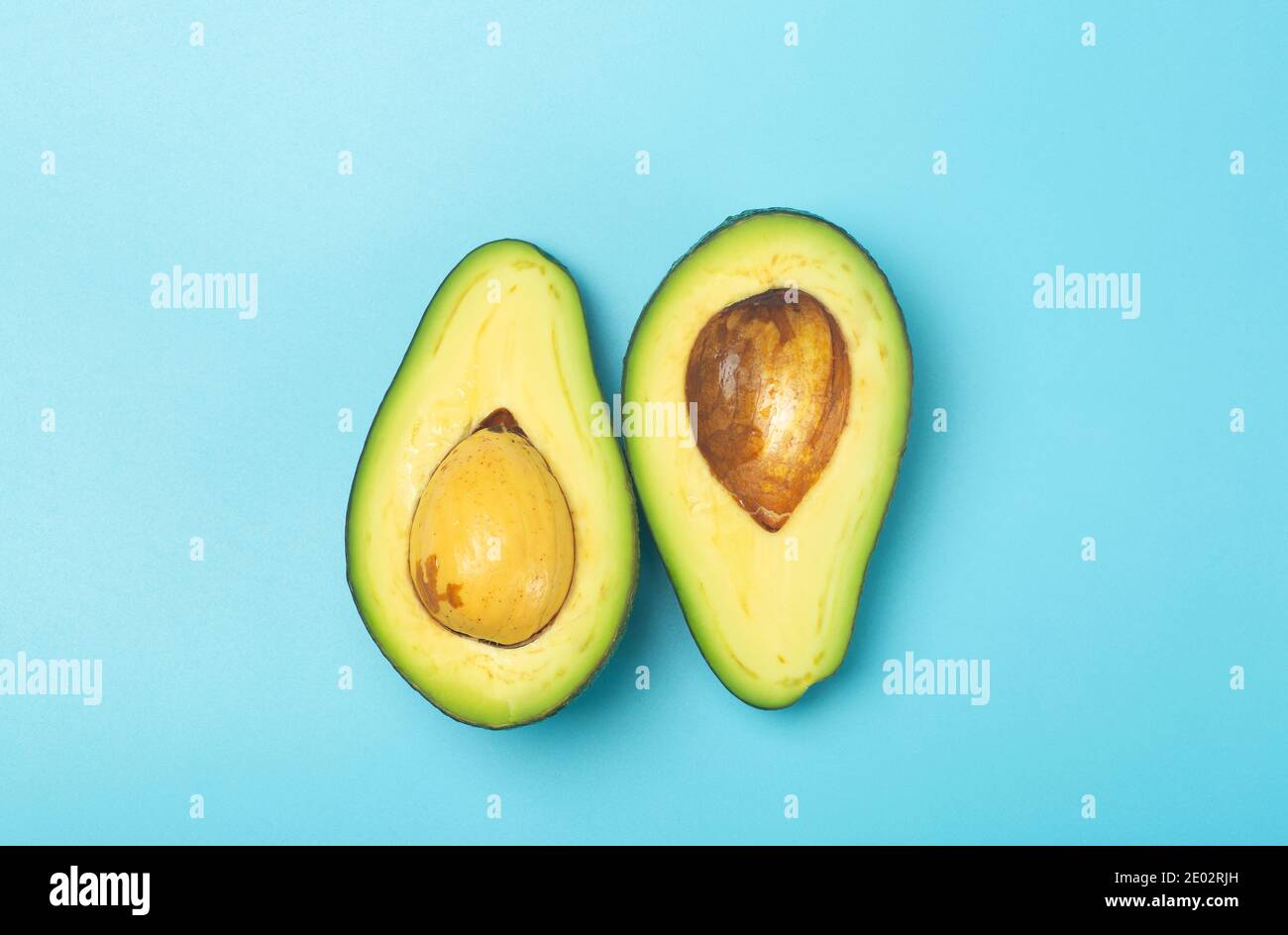 Avocado minimal background. Avocado on a colored pure blue background ...