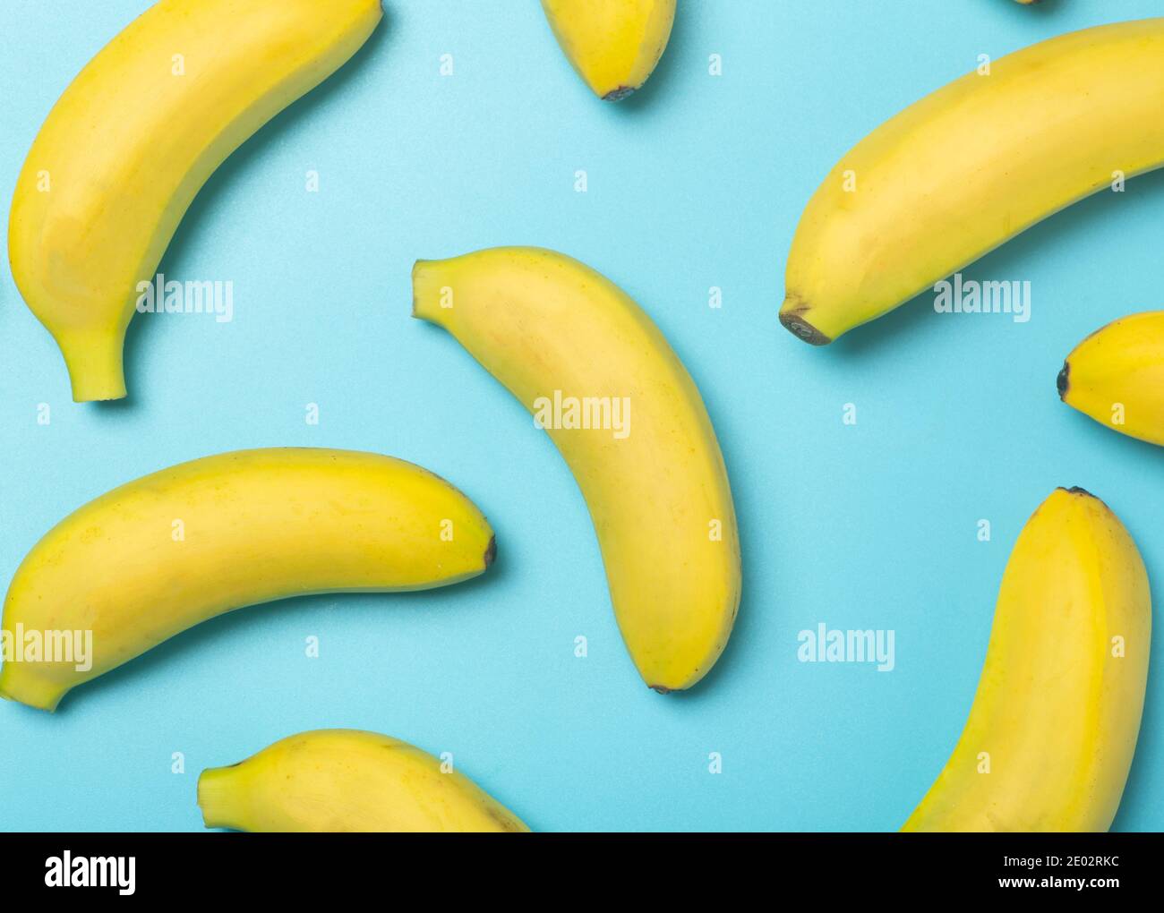Bananas on a colored background. Pattern of yellow fresh bananas on a ...