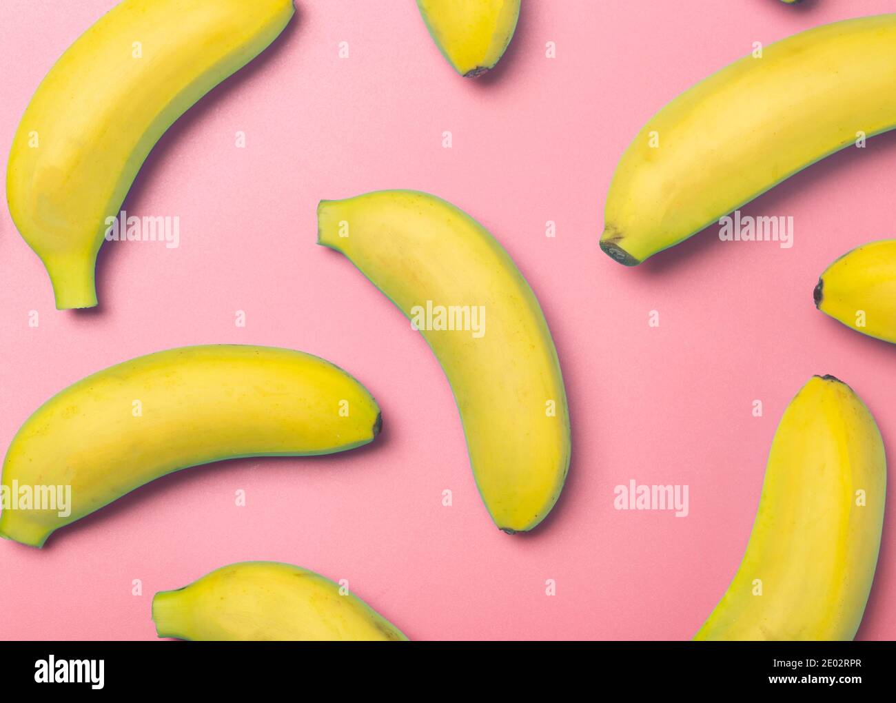 Bananas on a colored background. Pattern of yellow fresh bananas on a ...