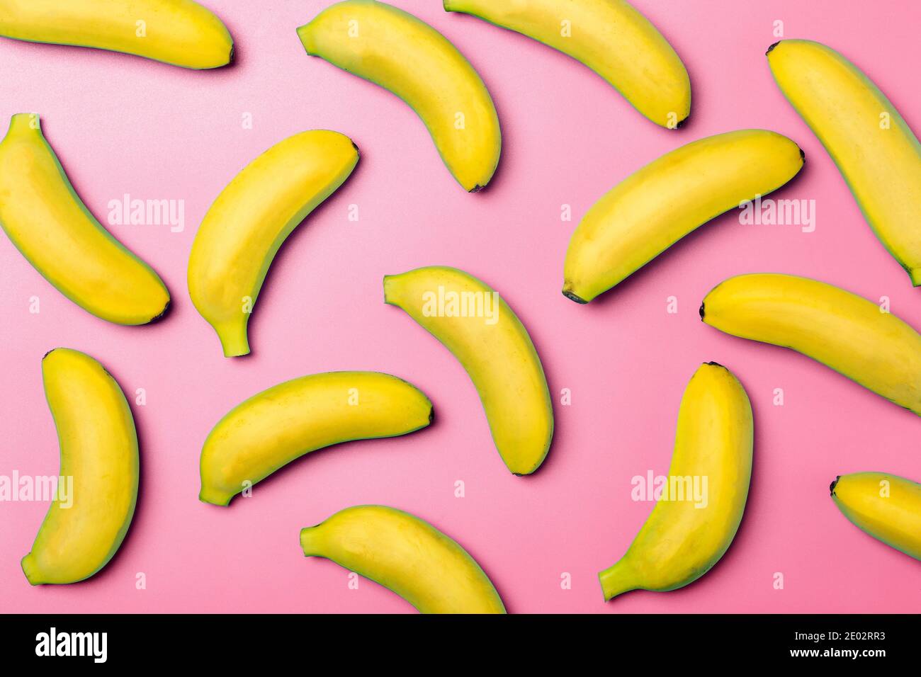 Bananas on a colored background. Pattern of yellow fresh bananas on a ...