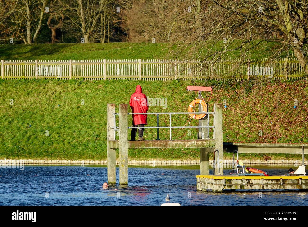 Lifeguard wearing winter Dry Robe coat on duty at Hampstead Men’s Pond ...