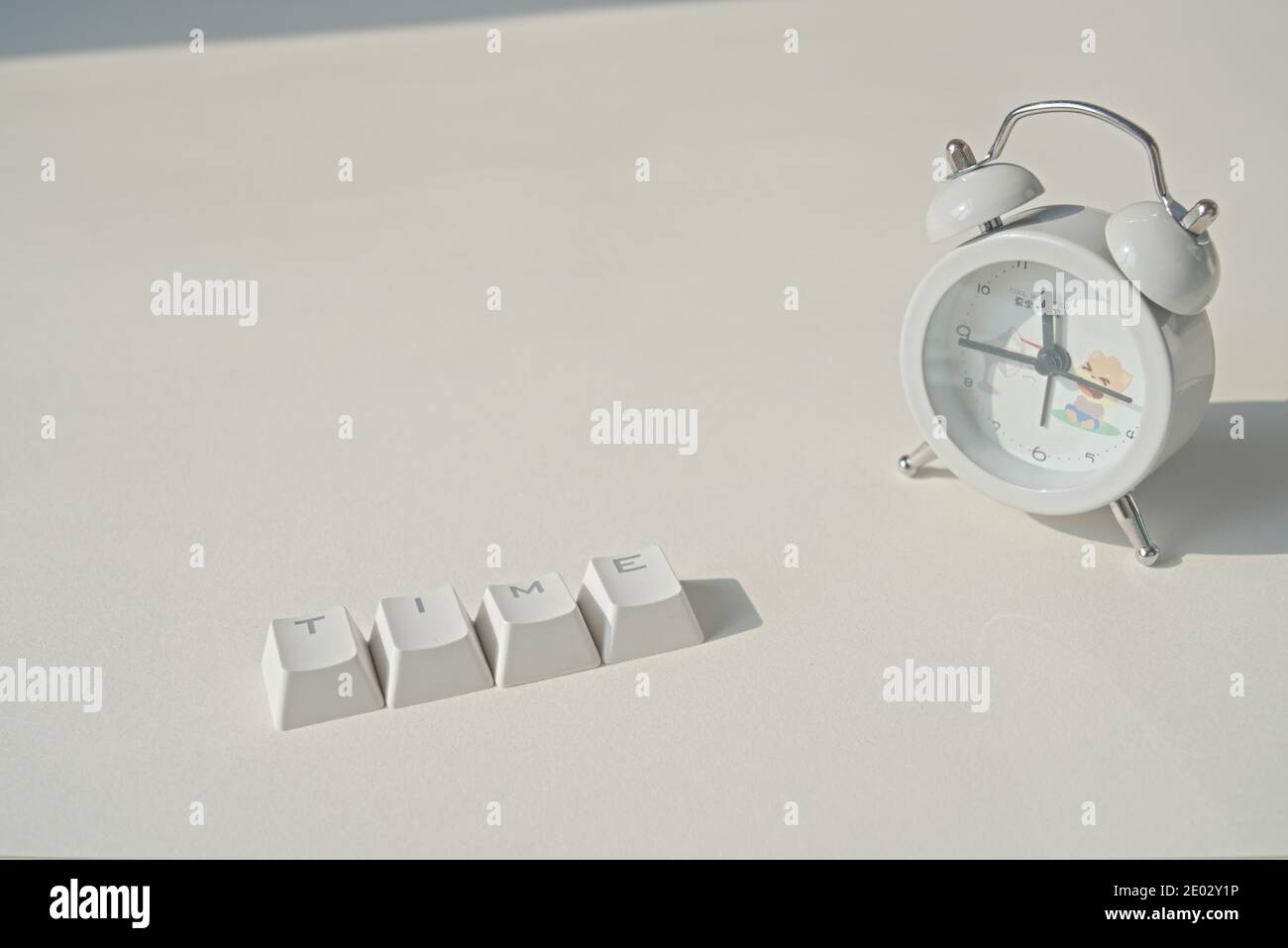 Time word composed of keyboard keys, clock on grey background, copy ...