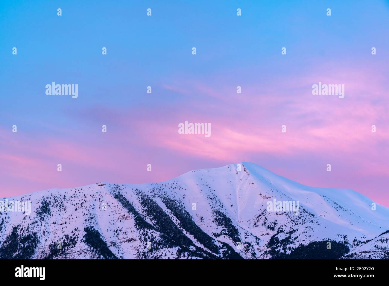 Closeup of amazing snowy mountains and red sunset, Pyrenees in Spain ...