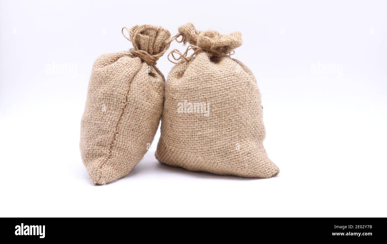 Two standing burlap sacks on white background Stock Photo - Alamy