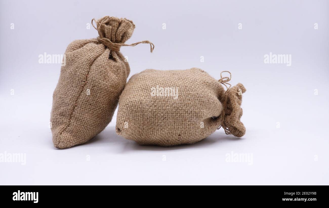 Two burlap sacks isolated on white background Stock Photo - Alamy