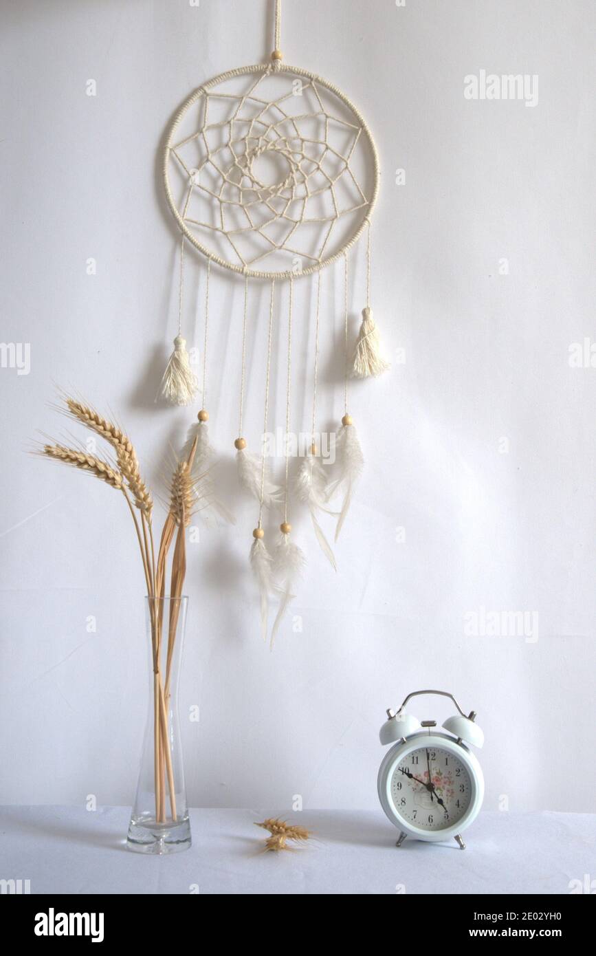 Handmade dreamcatcher and feather line, wheat ears, clock with white ...
