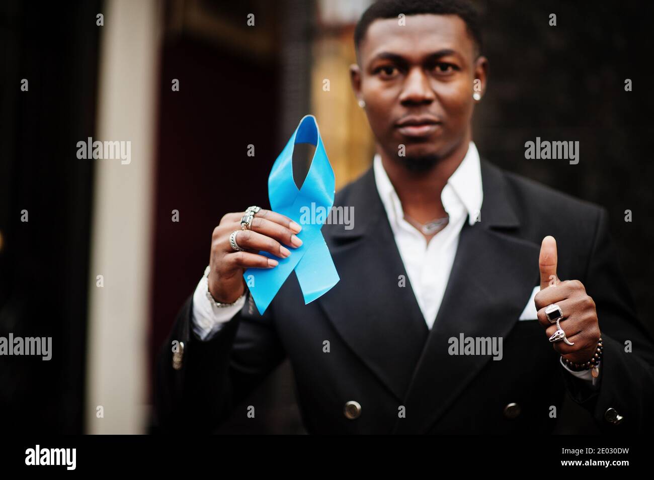 African american man hold blue prostate ribbon. Awareness cancer of men ...
