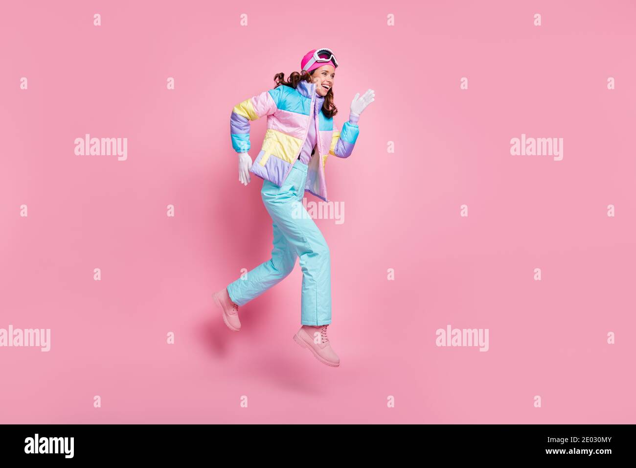 Full length profile side photo of lady snowboarder wear coat eyewear ...