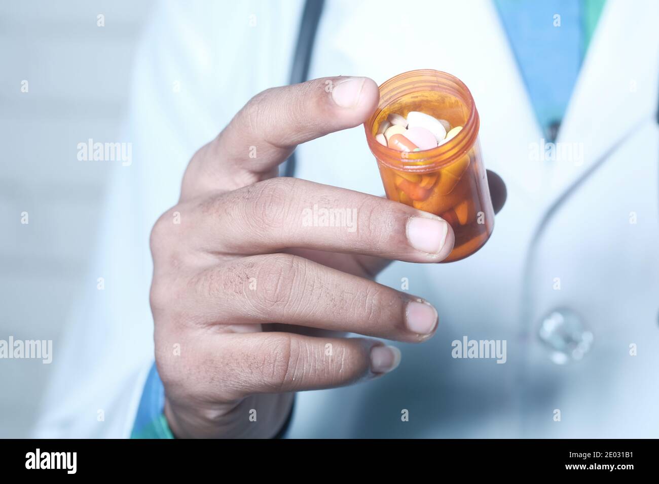 Doctor hand holding pill container hi-res stock photography and images ...