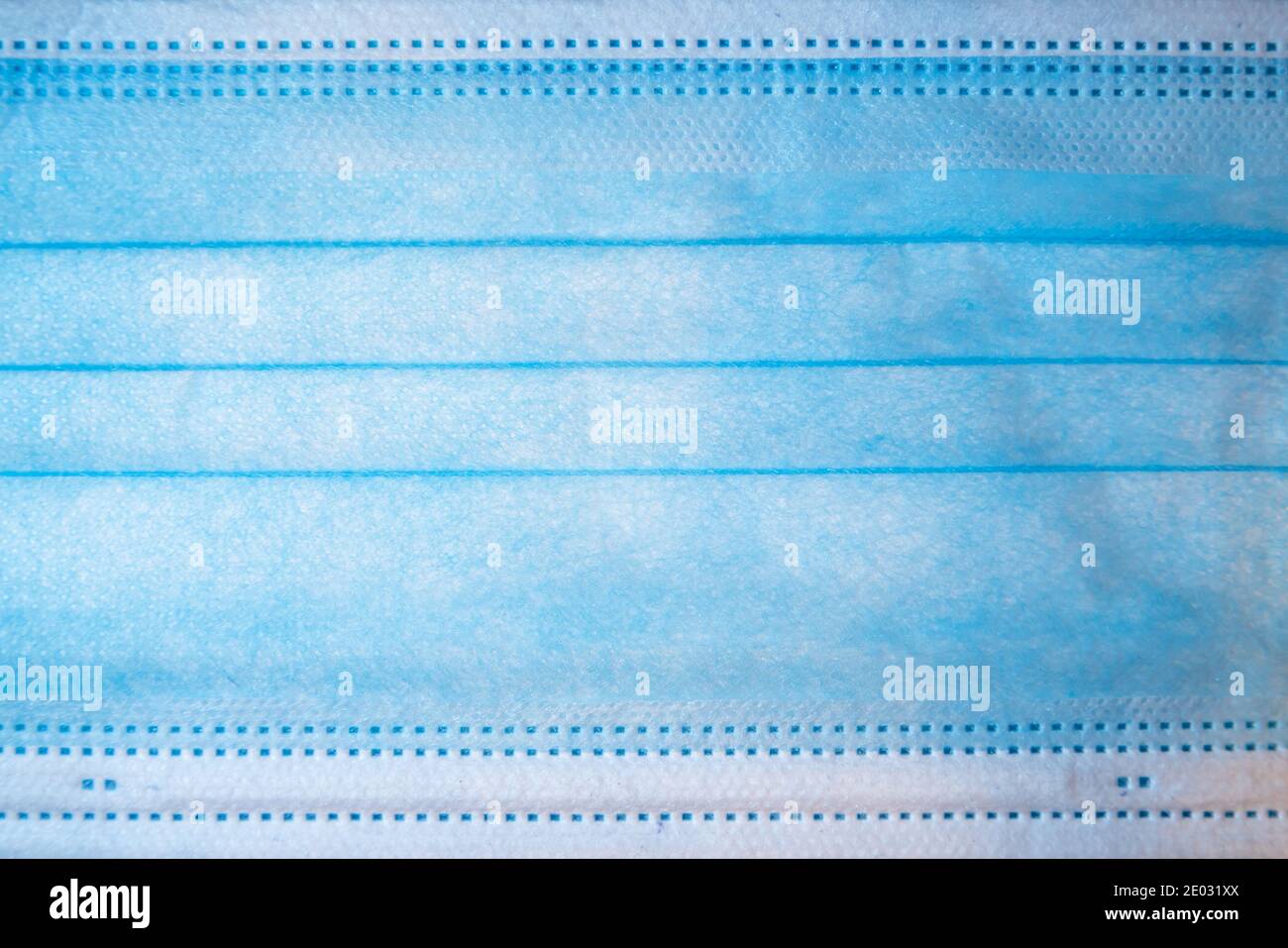 Blue medical face mask texture. Close up of surgical mask fabric with ...