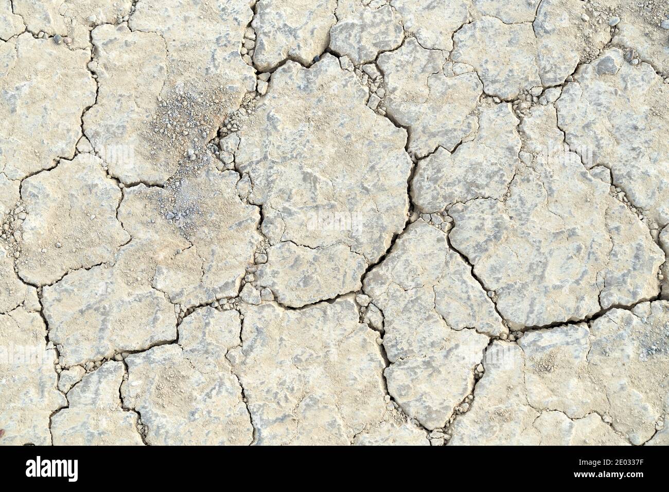 Above view of dry cracked clay with sand light color. Concept of dry ...