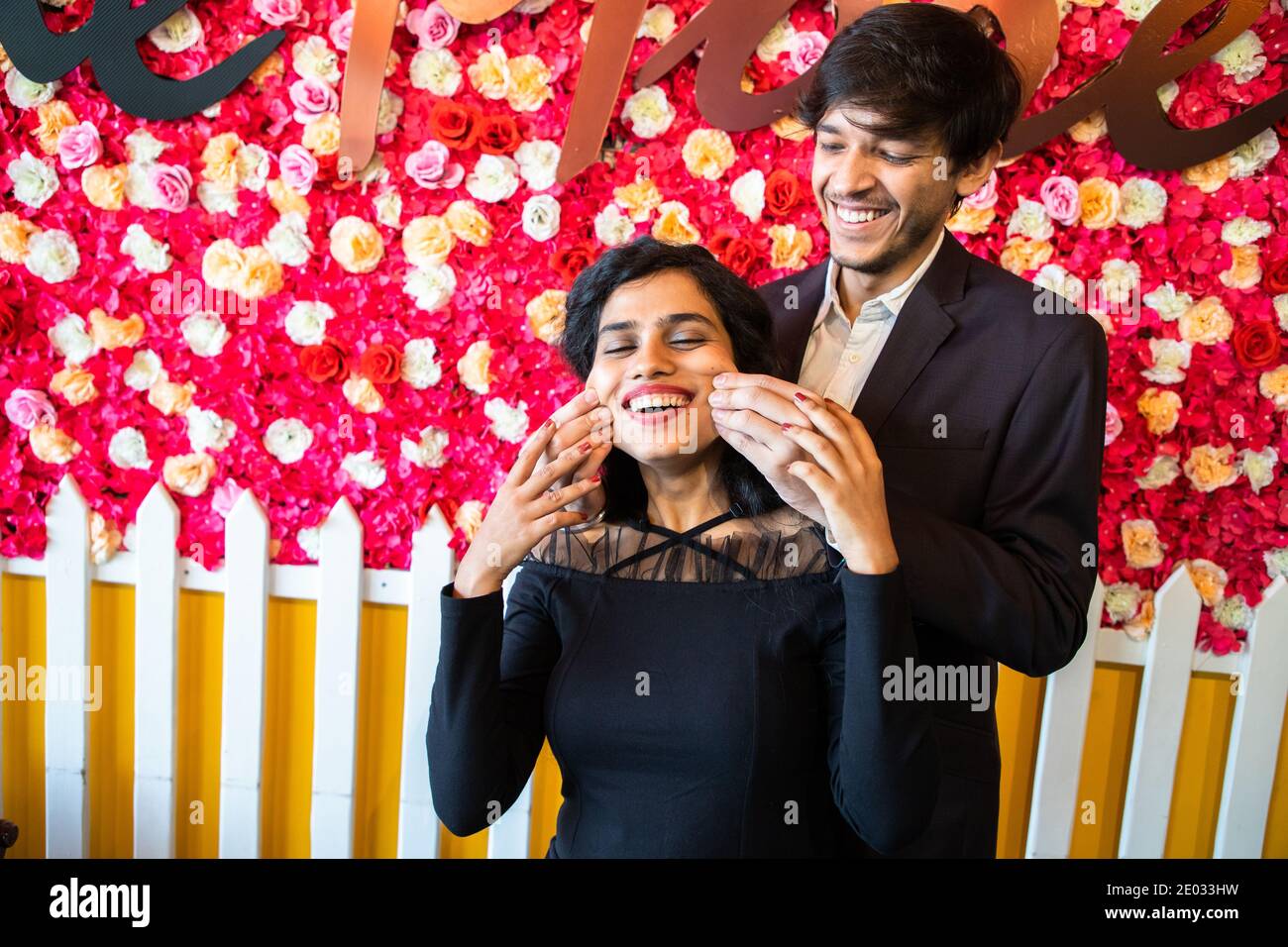 Pinching cheeks black hi-res stock photography and images - Alamy