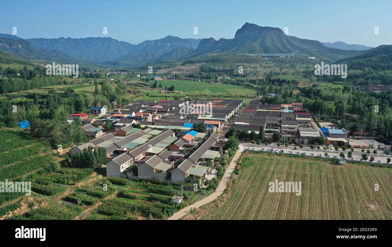 Aerial view of Chinese rural landscape, houses and green mountains ...