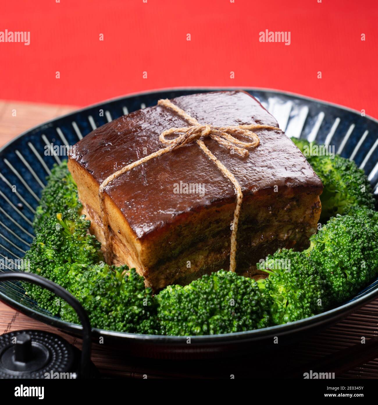 Dong Po Rou (Dongpo pork meat) in a beautiful blue plate with green ...