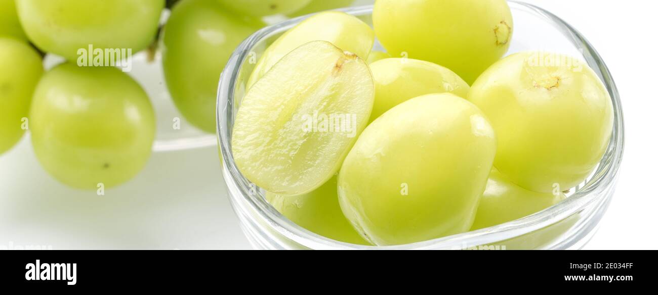Close up of beautiful boxed Shrine Muscat green grape isolated on white ...