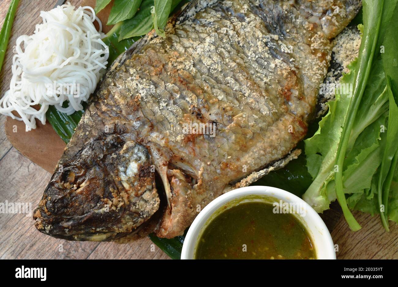 grilled mango fish wrapping salt eat couple with vegetable dipping ...