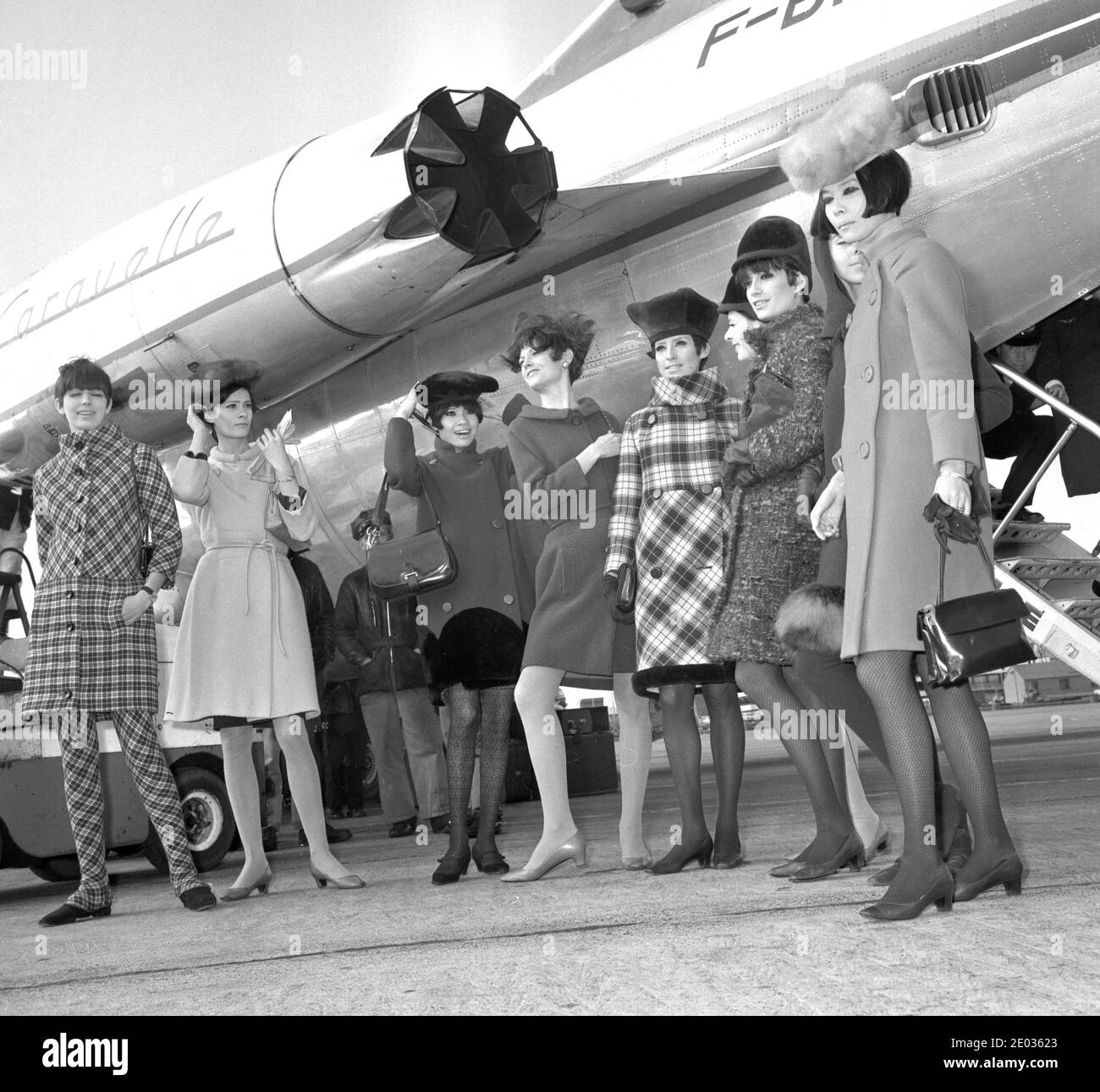 File photo dated 23/02/66 of Pierre Cardin models standing beneath the ...