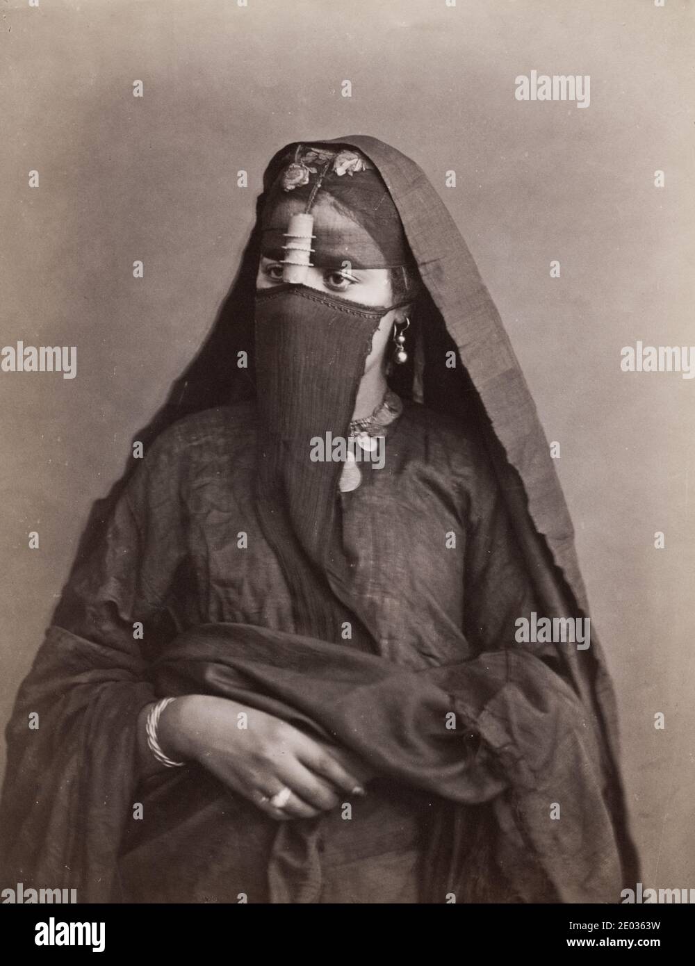 Vintage 19th century photograph - young Arab woman with a face veil ...