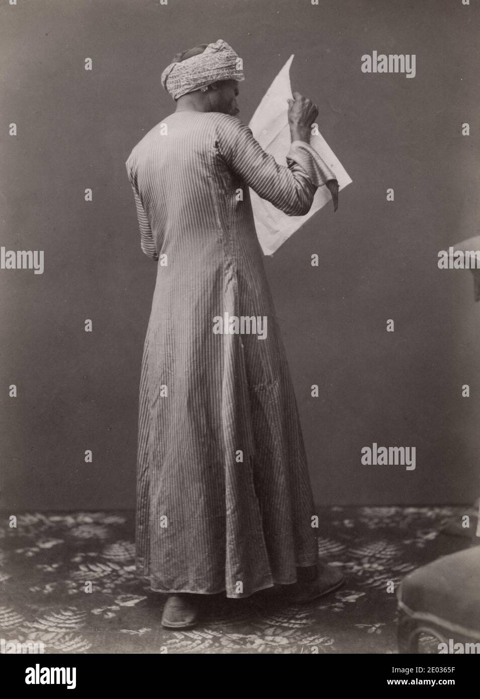 19th century vintage photograph - portrait of an Egyptian man reading a ...