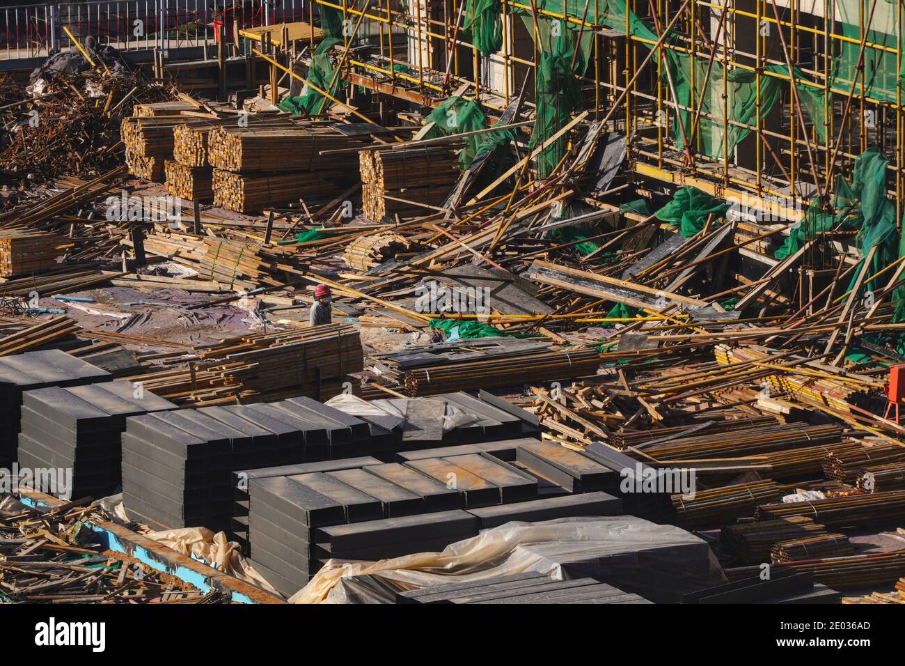 Various building materials on construction site, steel bars, cement ...