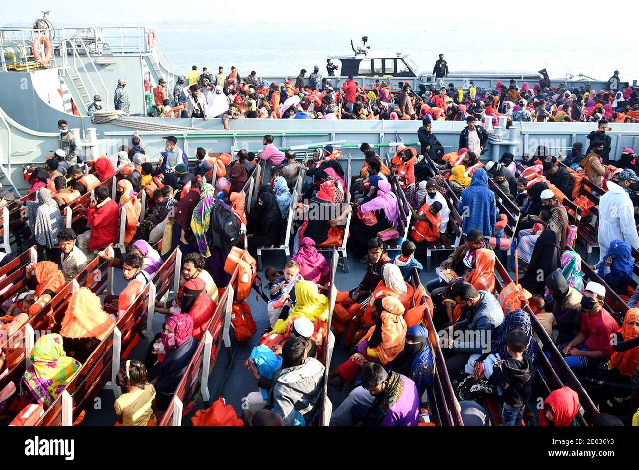 Rohingya refugees sit on a Bangladesh Navy ship as they are relocated ...