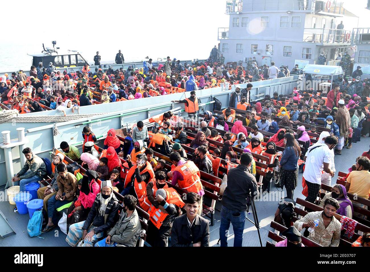 Rohingya refugees sit on a Bangladesh Navy ship as they are relocated ...