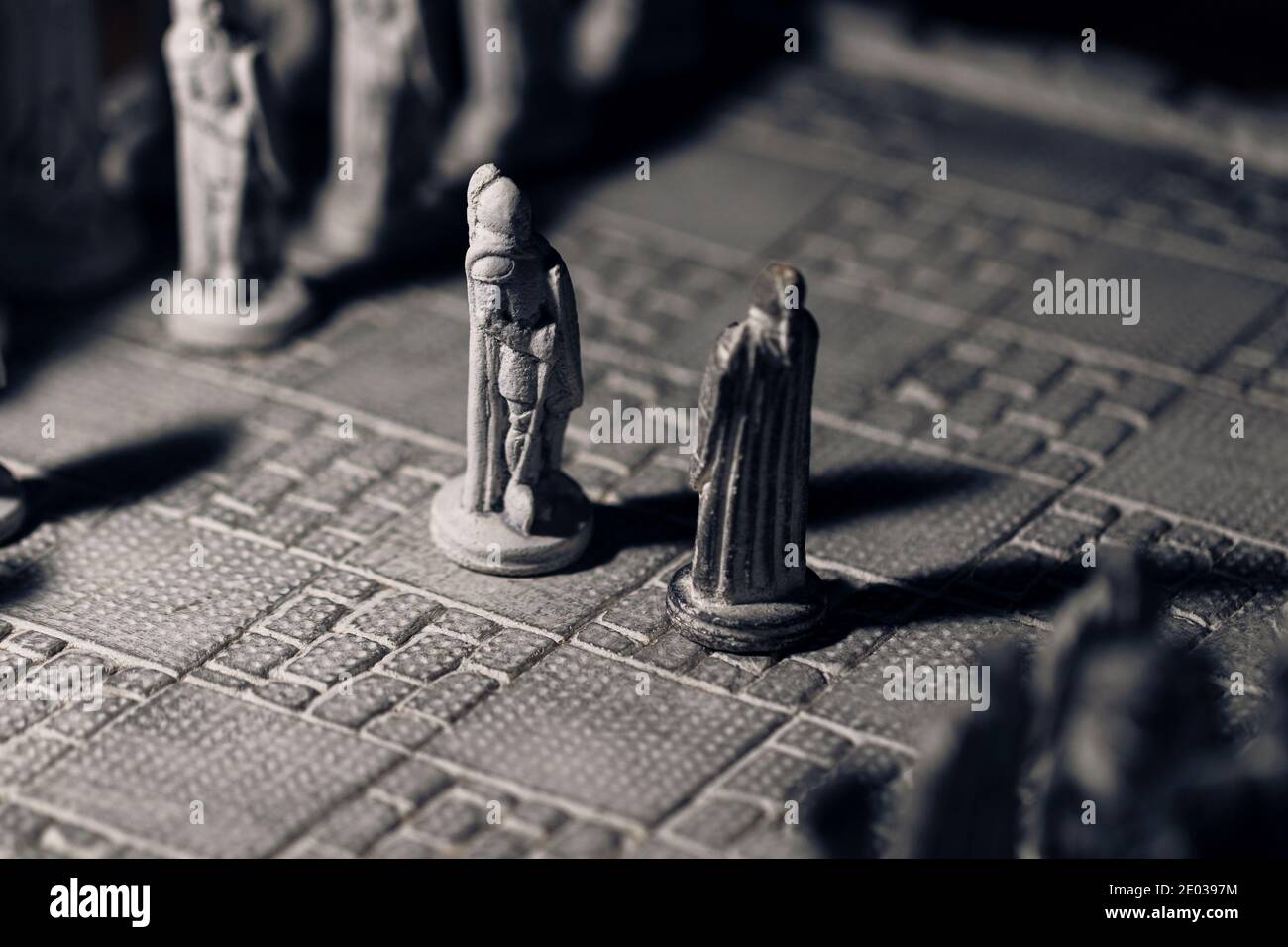 A black and white portrait of two soldier pieces of a game of chess ...