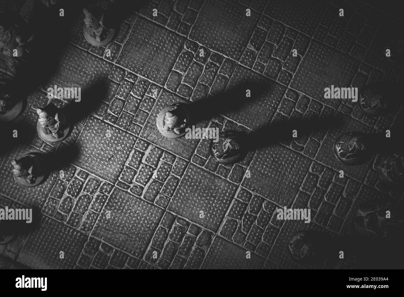 A top down portrait of the beginning of a match of chess. The ...