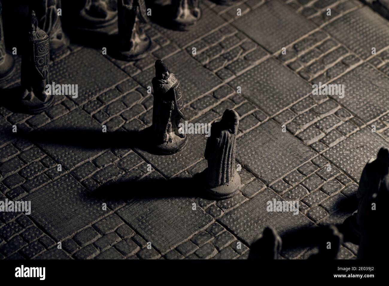 A portrait of two soldier pieces of a game of chess facing each other ...