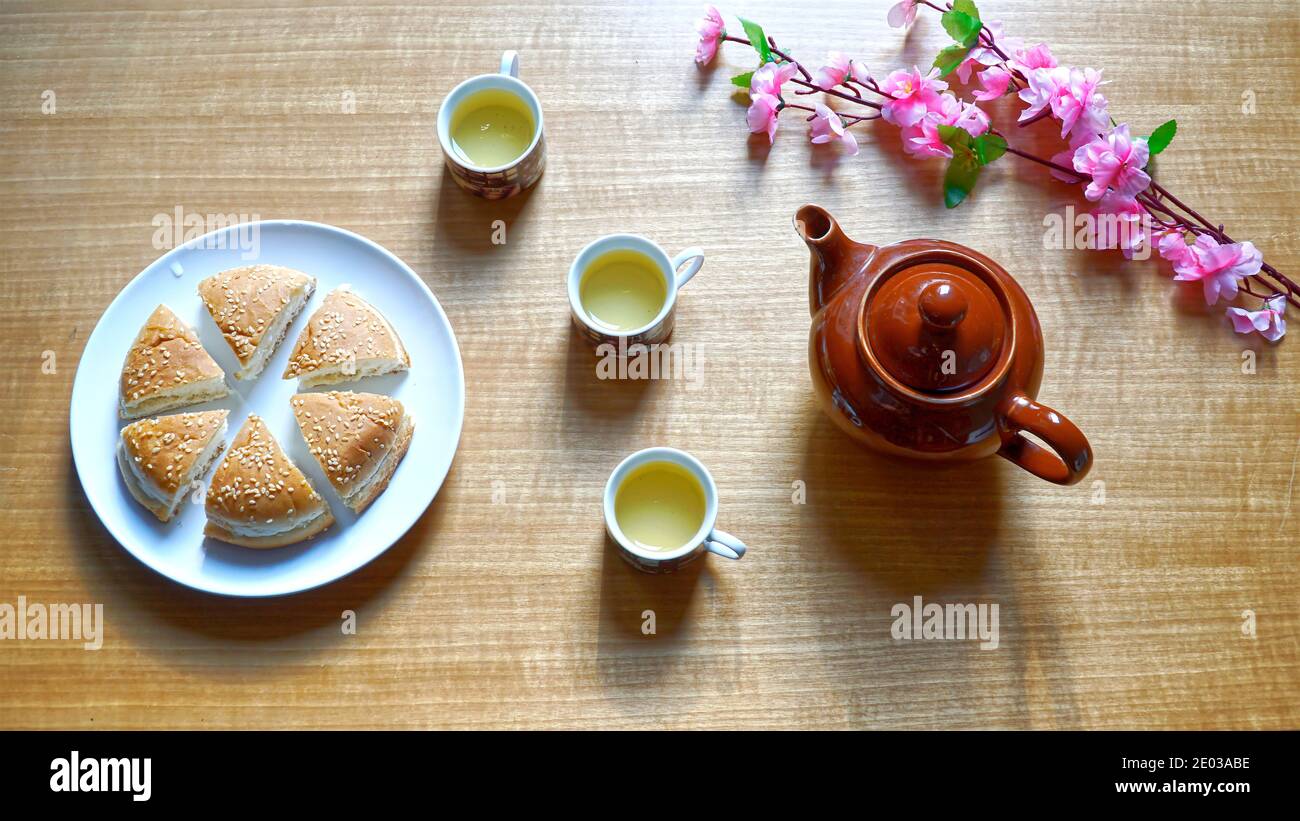Traditional afternoon tea concept, cut homemade bread and Chinese tea ...