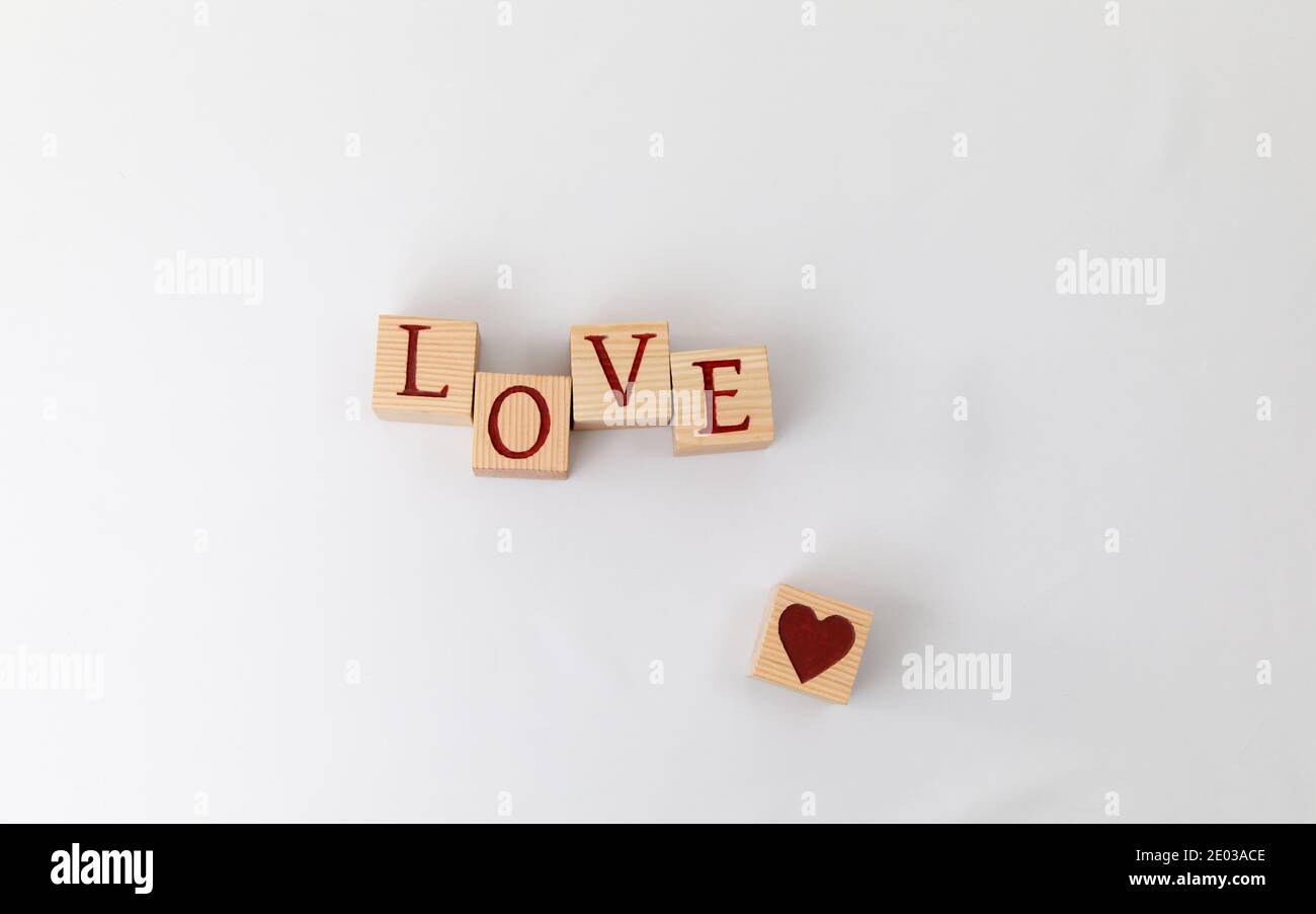 Love word written with square wooden blocks isolated on white ...