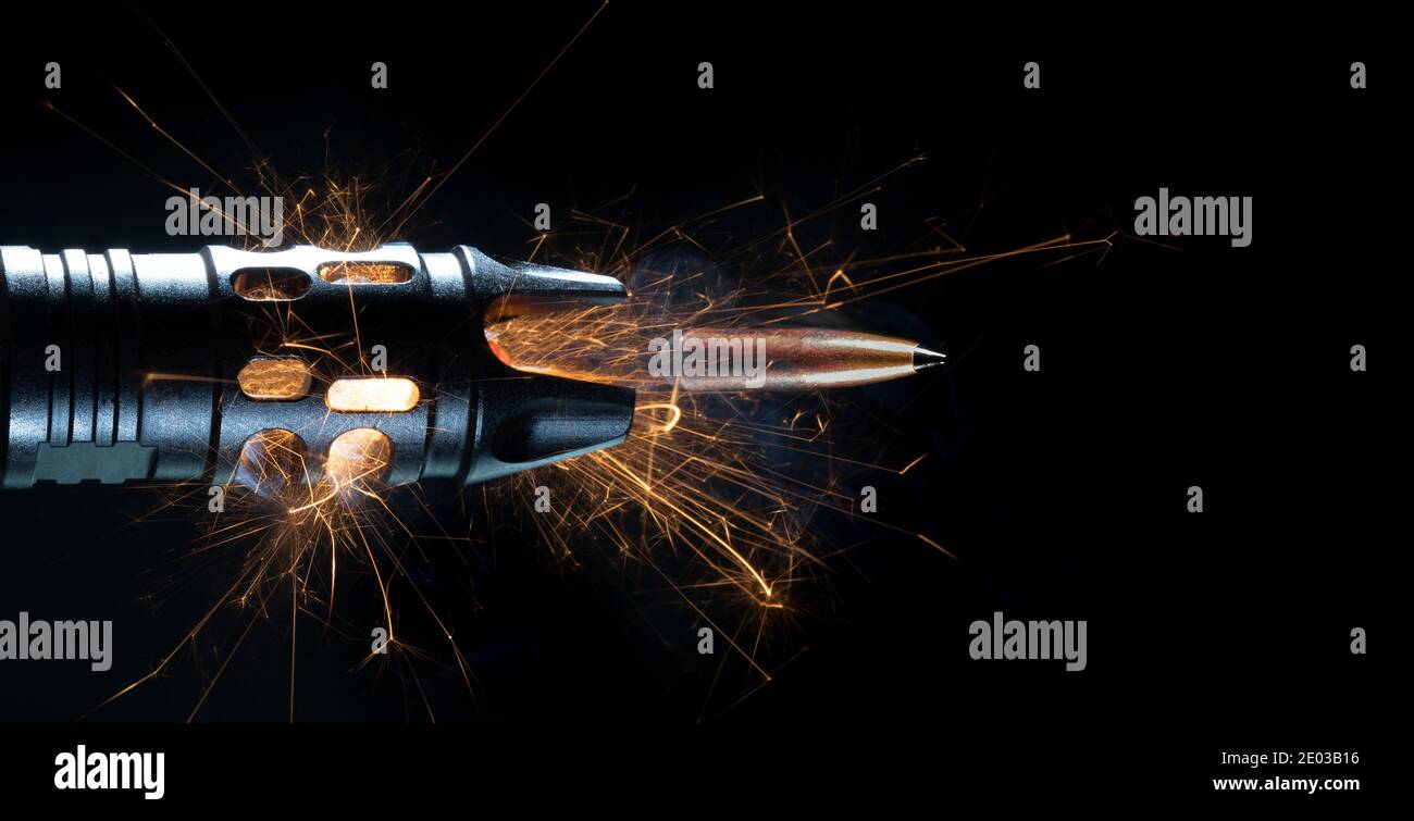 Copper plated bullet with smoke and sparks leaving the barrel of an AR ...