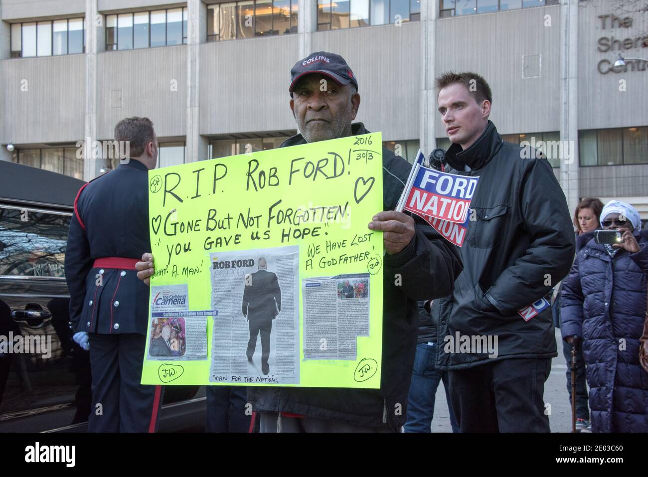 Afro American supporter during Rob Ford funeral march toward St. James ...