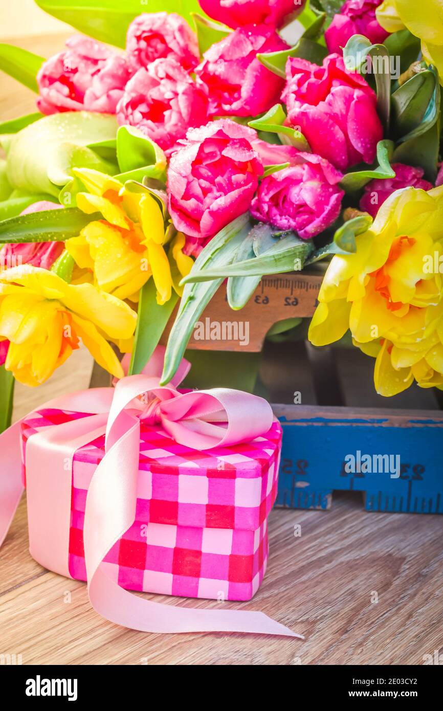 spring flowers with gift box Stock Photo - Alamy