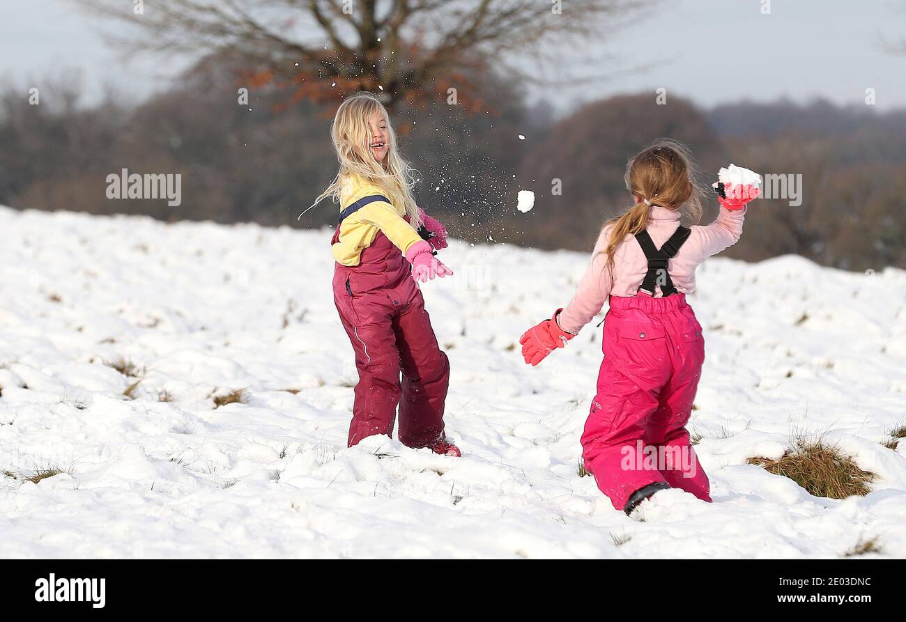 Ruby Millington (left) and Molly Chamberlain play in the snow at Tatton ...
