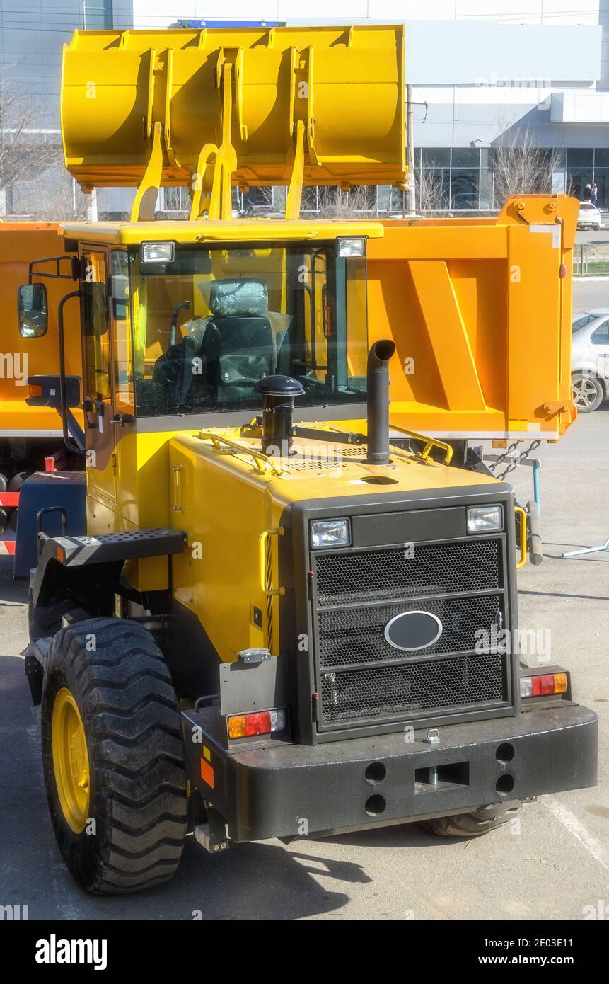 front loader loading the truck (all logos, inscriptions and markings ...