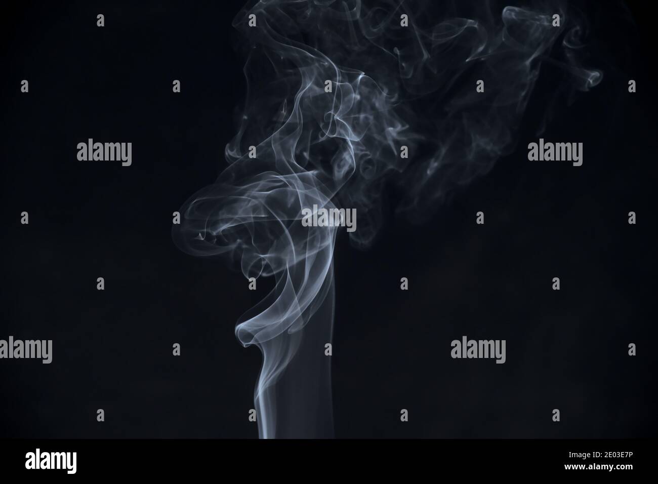 Cigarette smoke on black background, can be used for no smoking theme ...