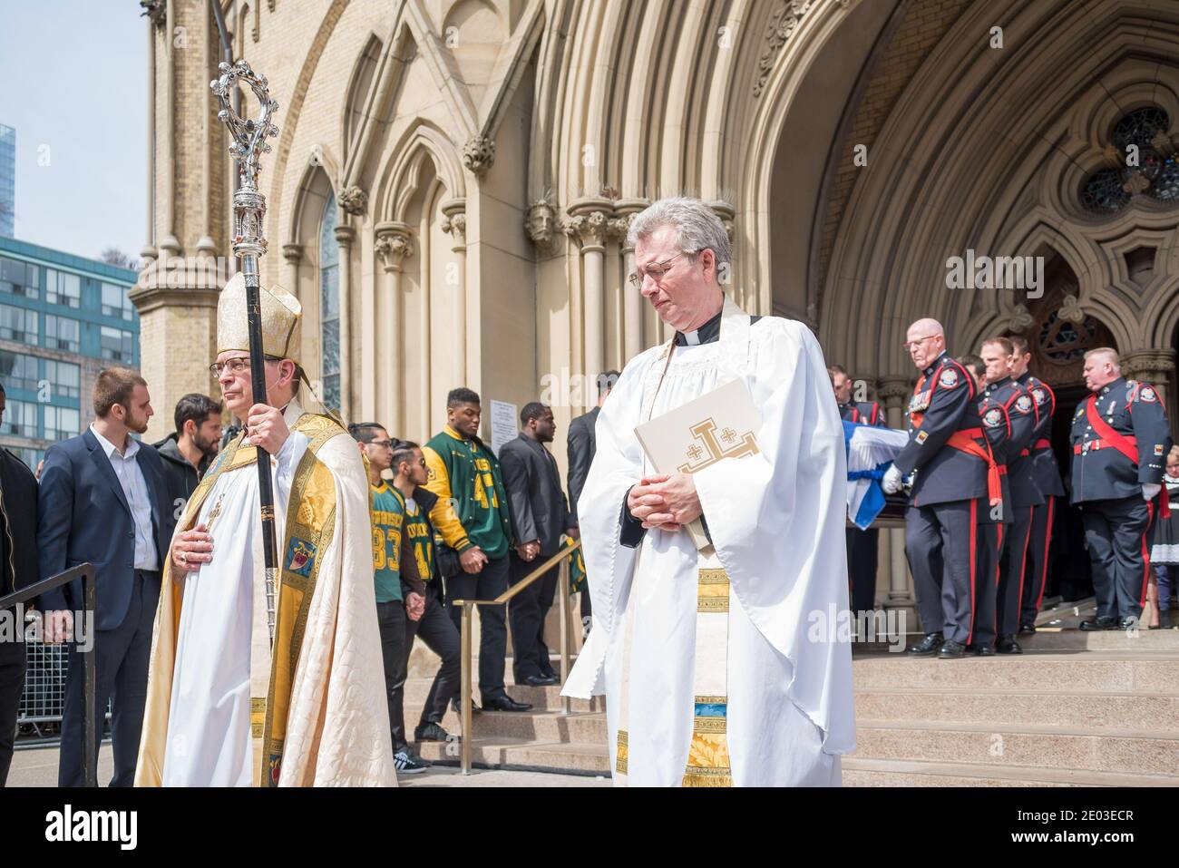 St. James Cathedral religious staff lead the way of Rob Ford casket ...